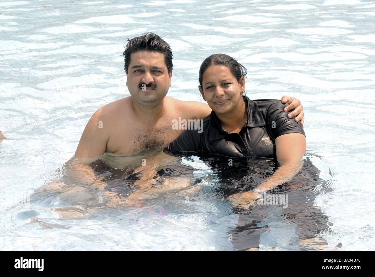 Indian couple hugging swimming pool, India, Asia, MR#152, Asia Stock ...