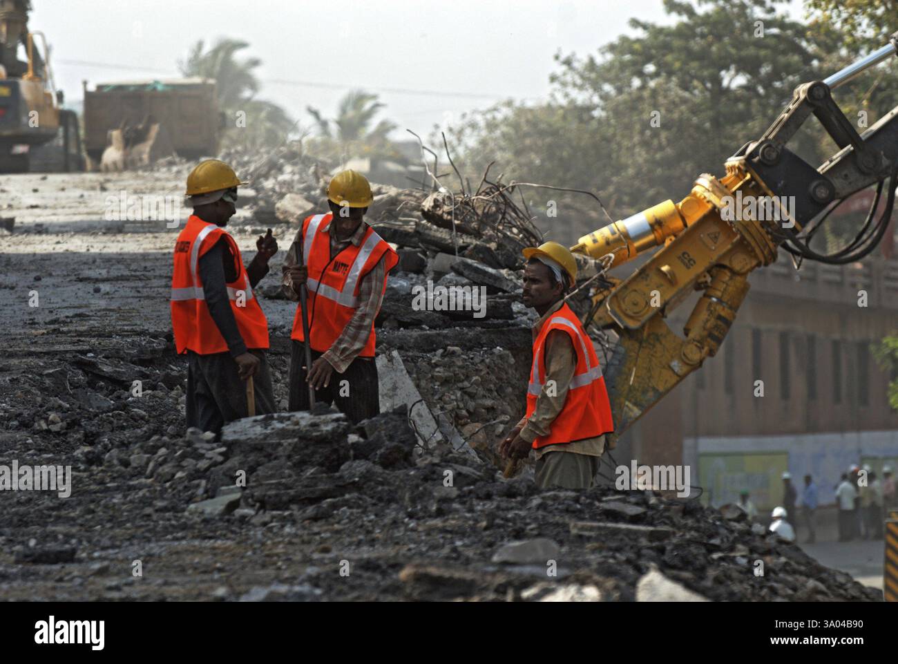 Workers demolishing lalbaug flyover using heavy machinery in Bombay ...