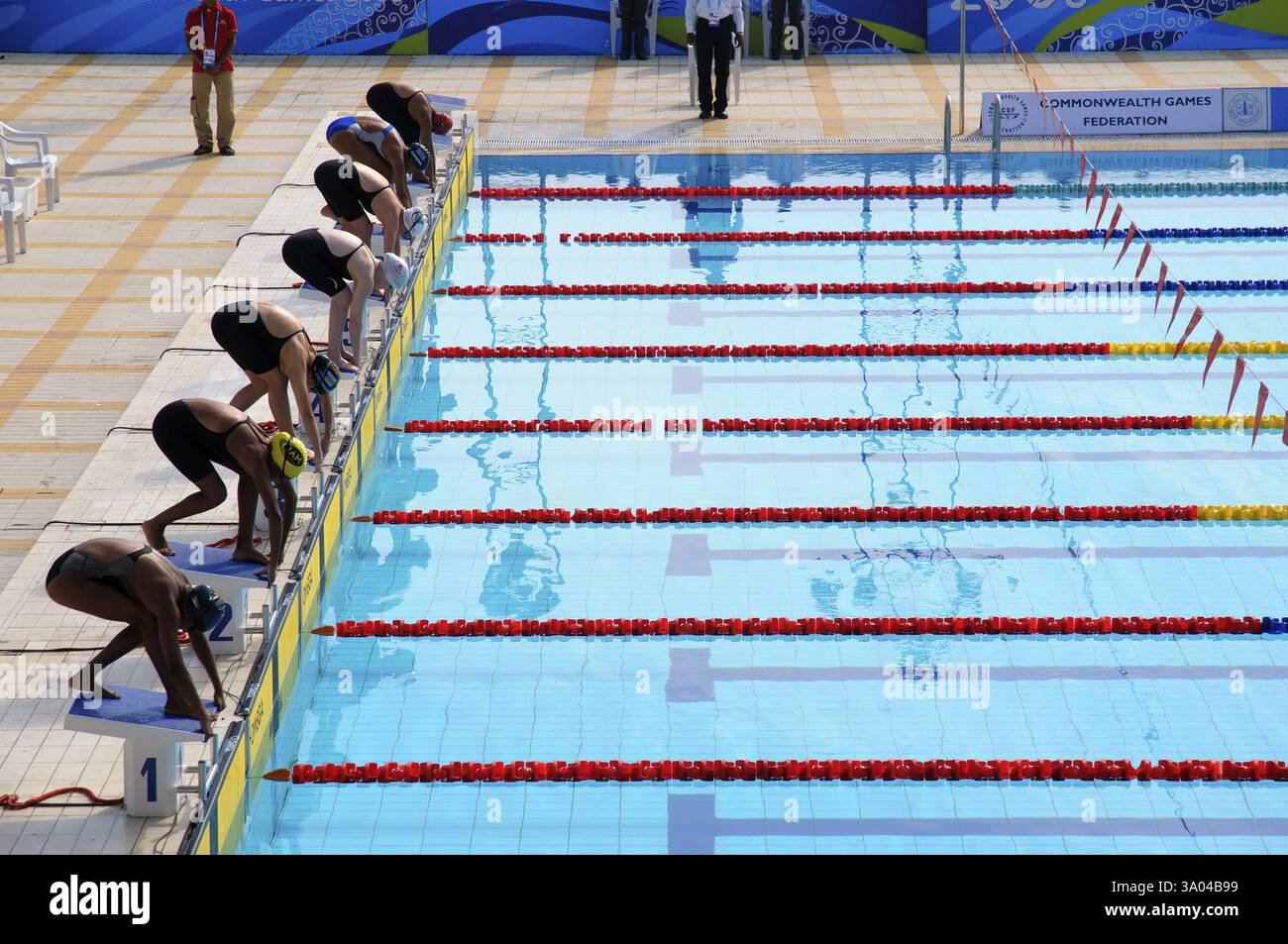 Swimmers lined up ready to dive in swimming pool of shree shiv ...
