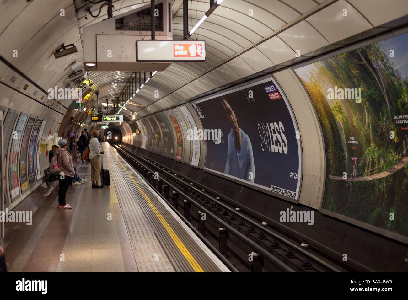 Angel underground station, London Underground. Train arriving emerging ...