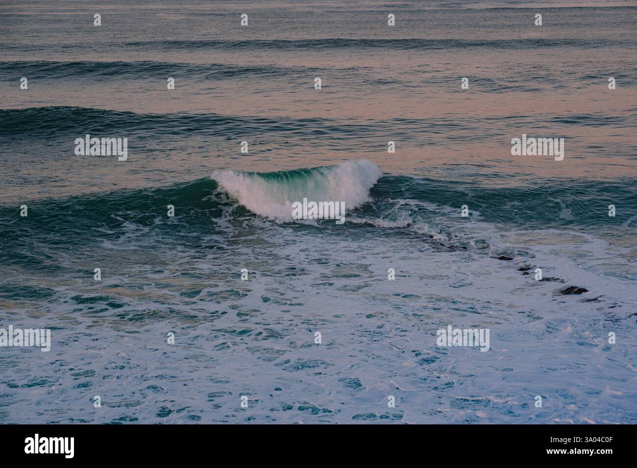 A wave rising in the ocean. Photo on a long exposure, the wave is ...
