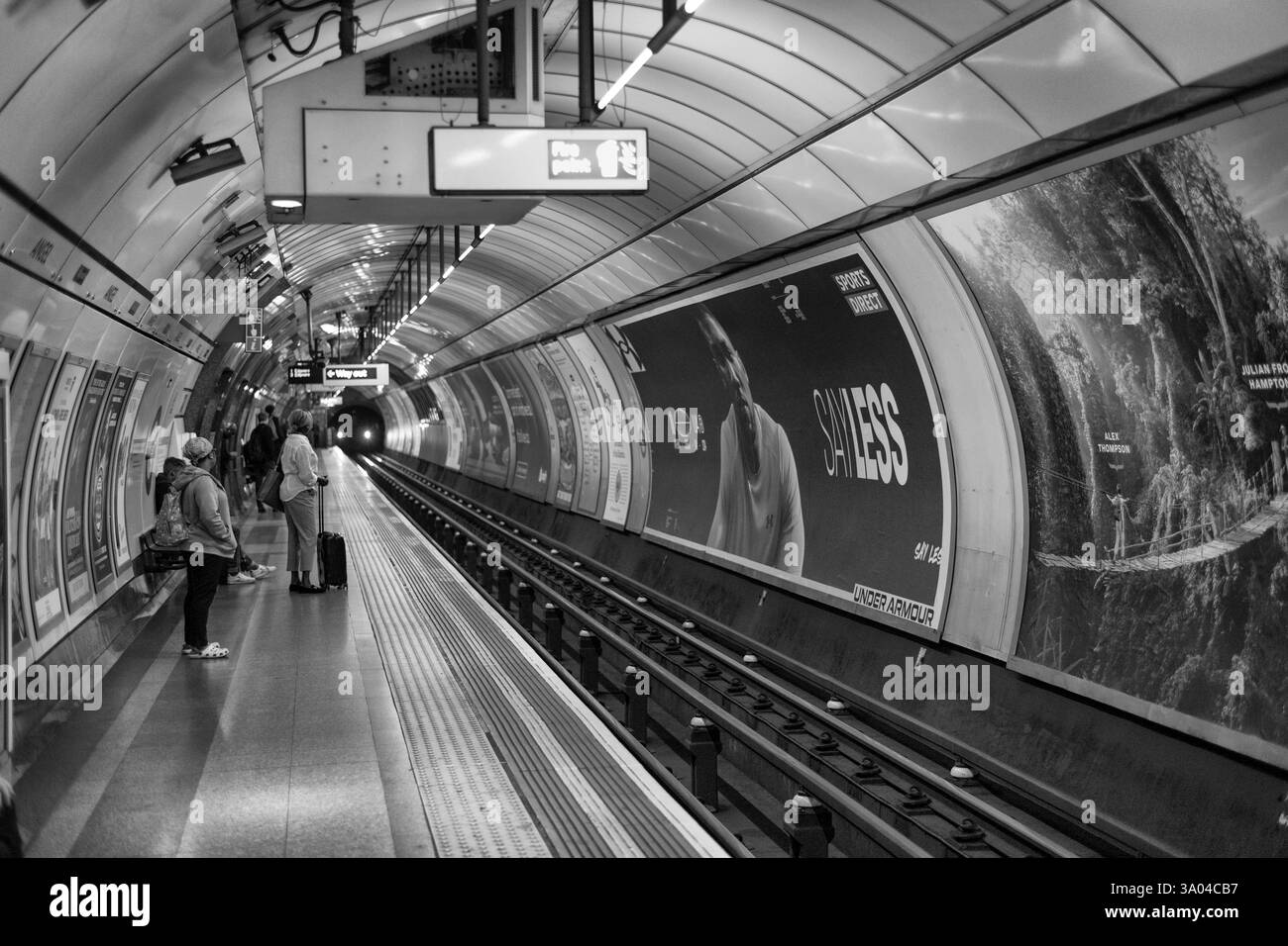 Angel underground station, London Underground. Train arriving emerging ...