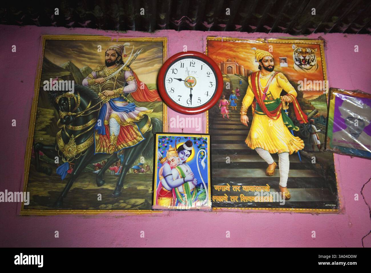 Photographs of shivaji and gods ram hugging hanuman on wall ...