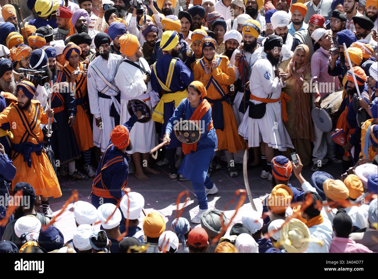 Nihang Sikh devotees perform martial skill in crowd on occasion of Hola ...