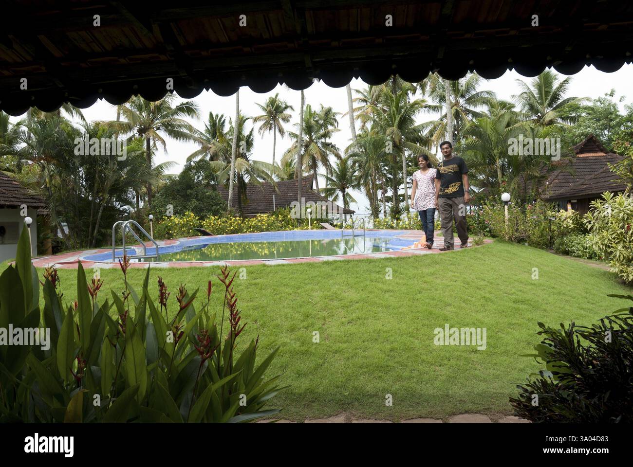 Couple at swimming pool in heritage lake resort, Kuttanad, Alleppey ...