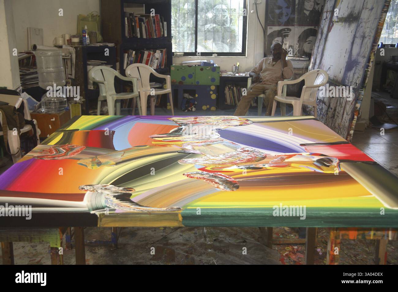 Indian contemporary artist Bose Krishnamachari in his studio working on ...