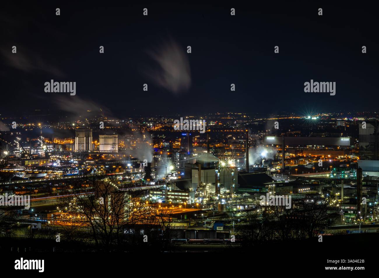 Night evening winter view from hill for city and factories in Linz ...