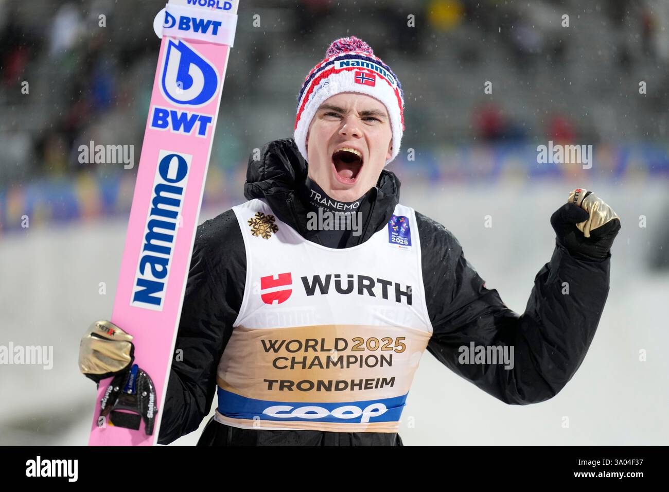 Marius Lindvik, of Norway, celebrates after winning the gold medal in ...