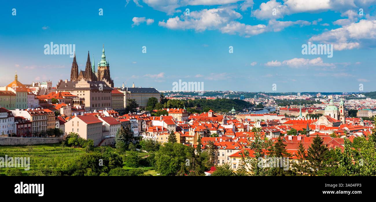 View of Prague featuring historic castle and vibrant rooftops on a ...
