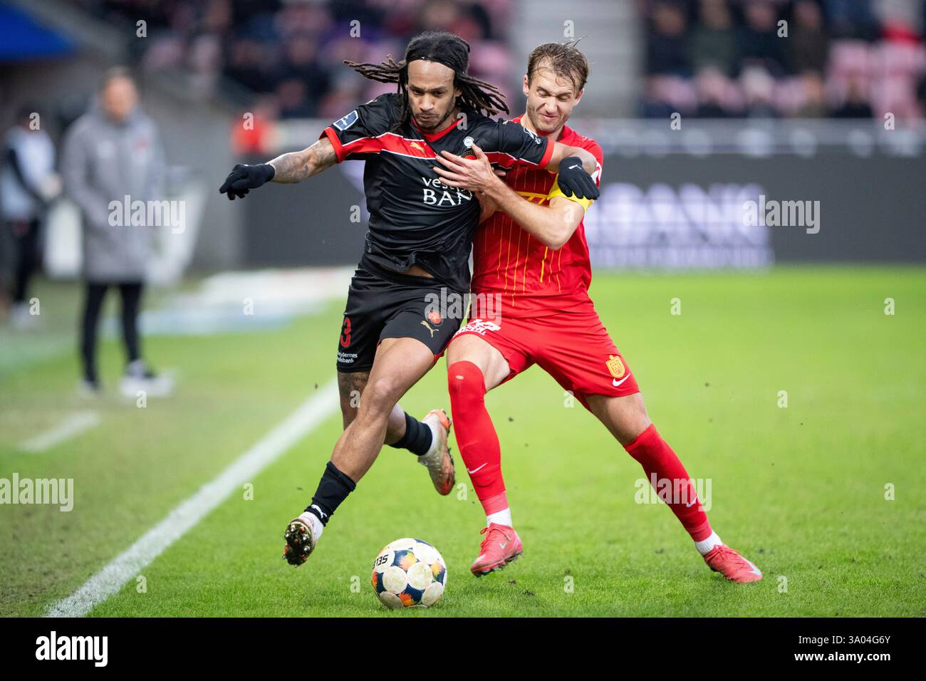 FC Midtjylland's Kevin Mbabu in a match with FCN's Benjamin Nygren ...