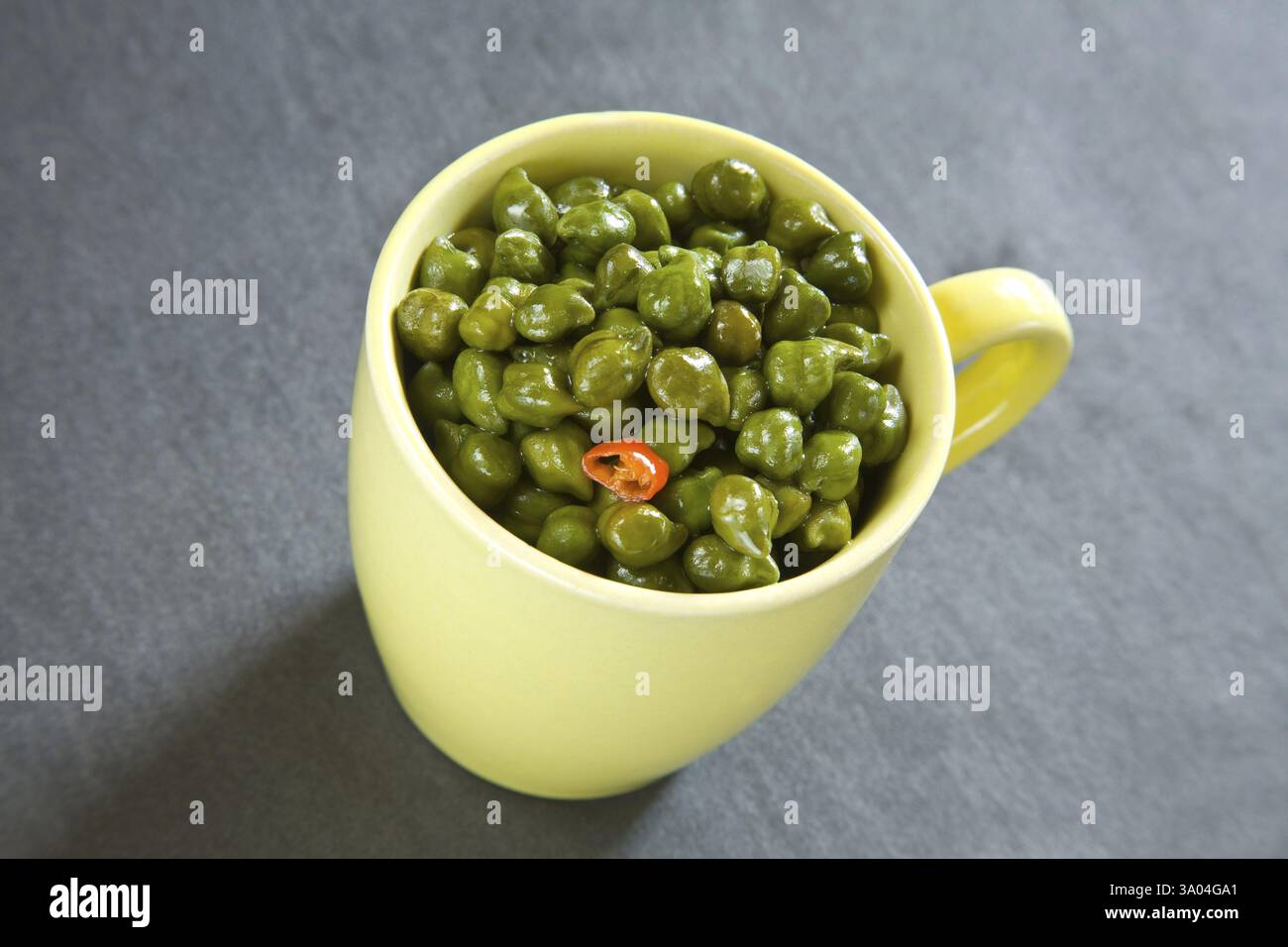 Indian breakfast green chickpeas chana salad served in mug on black ...