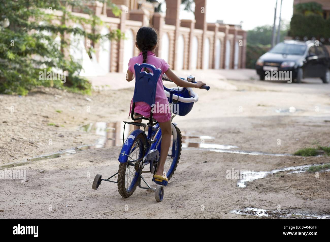 Girl riding on bicycle, Rajasthan, India MR#746B Stock Photo - Alamy