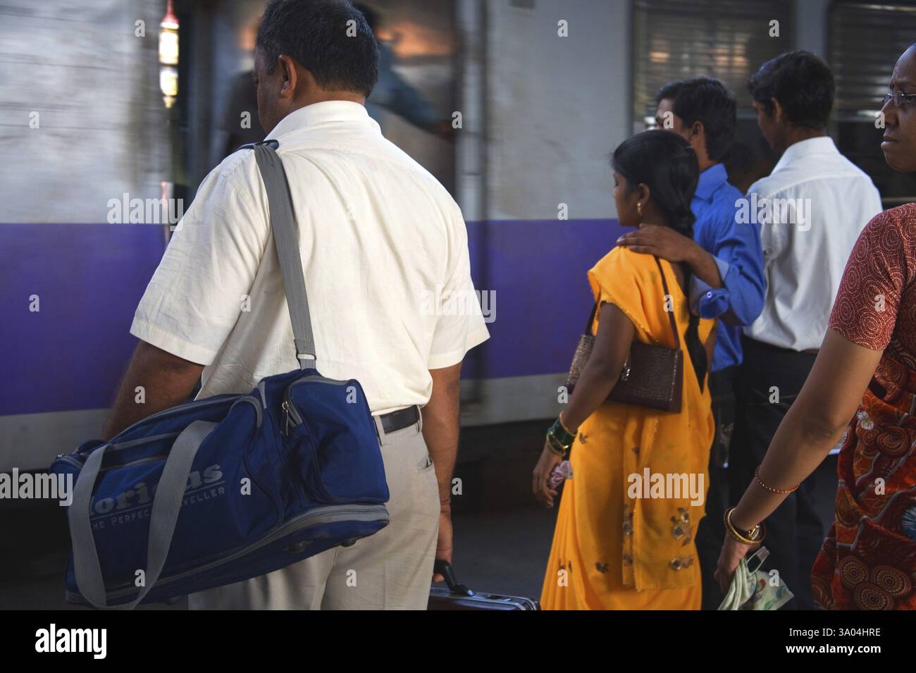 Commuters waiting to get into local train on platform of Borivali ...
