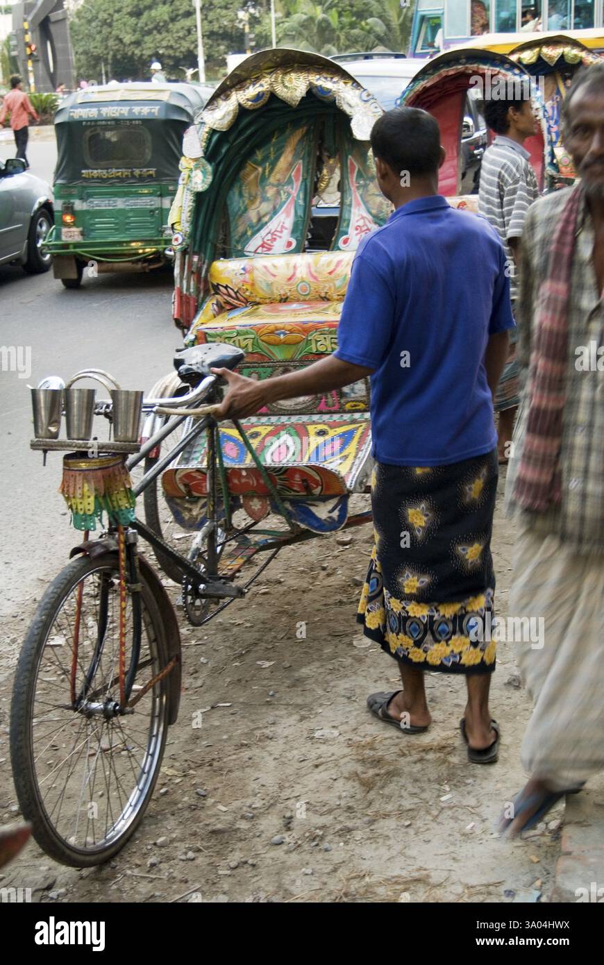 Cycle Rickshaw Rider with Vehicle on street at Dhaka, Bangladesh, Asia Stock Photo - Alamy