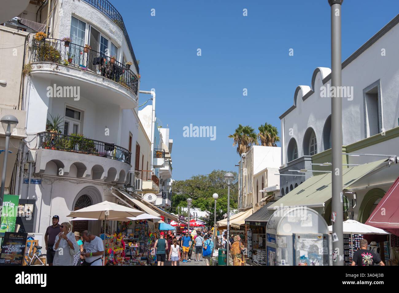 Kos Greece - August 21 2024; Crowded street of retail and tourist shops ...
