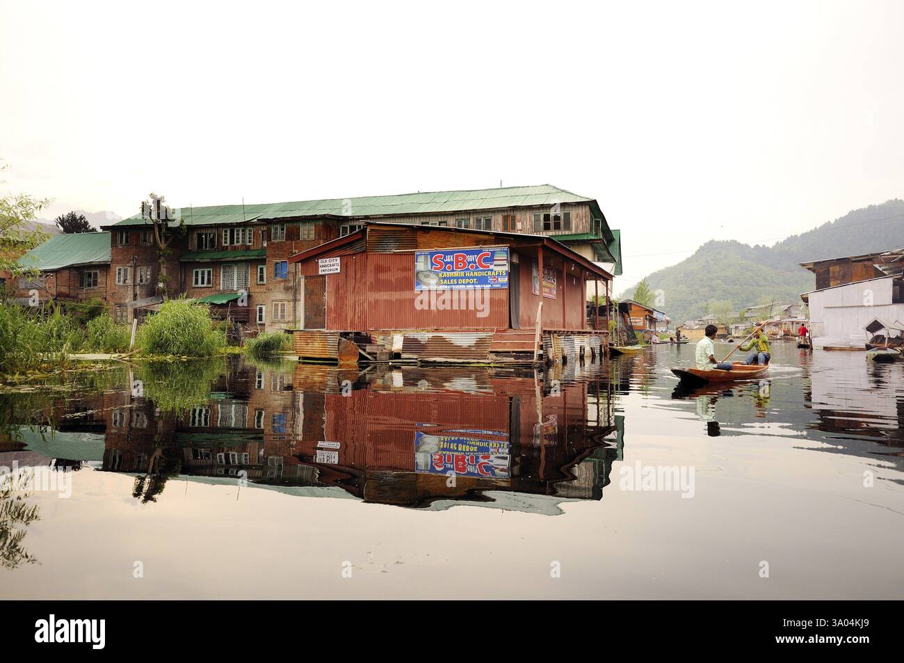 People travelling on canoe in dal lake, Srinagar, Jammu and Kashmir ...
