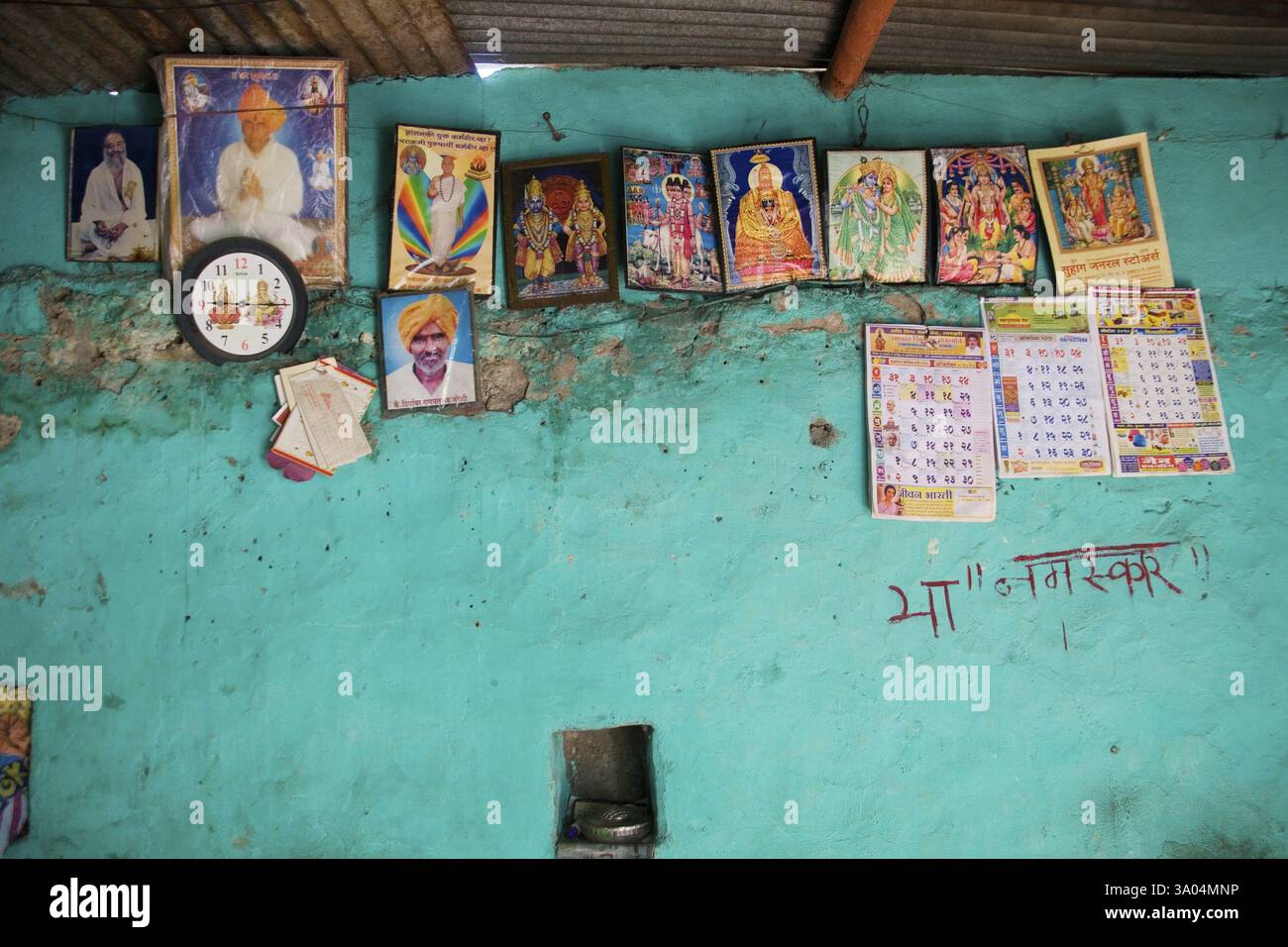 Photographs of gods on wall in house, Nandur, Marathwada, Maharashtra ...