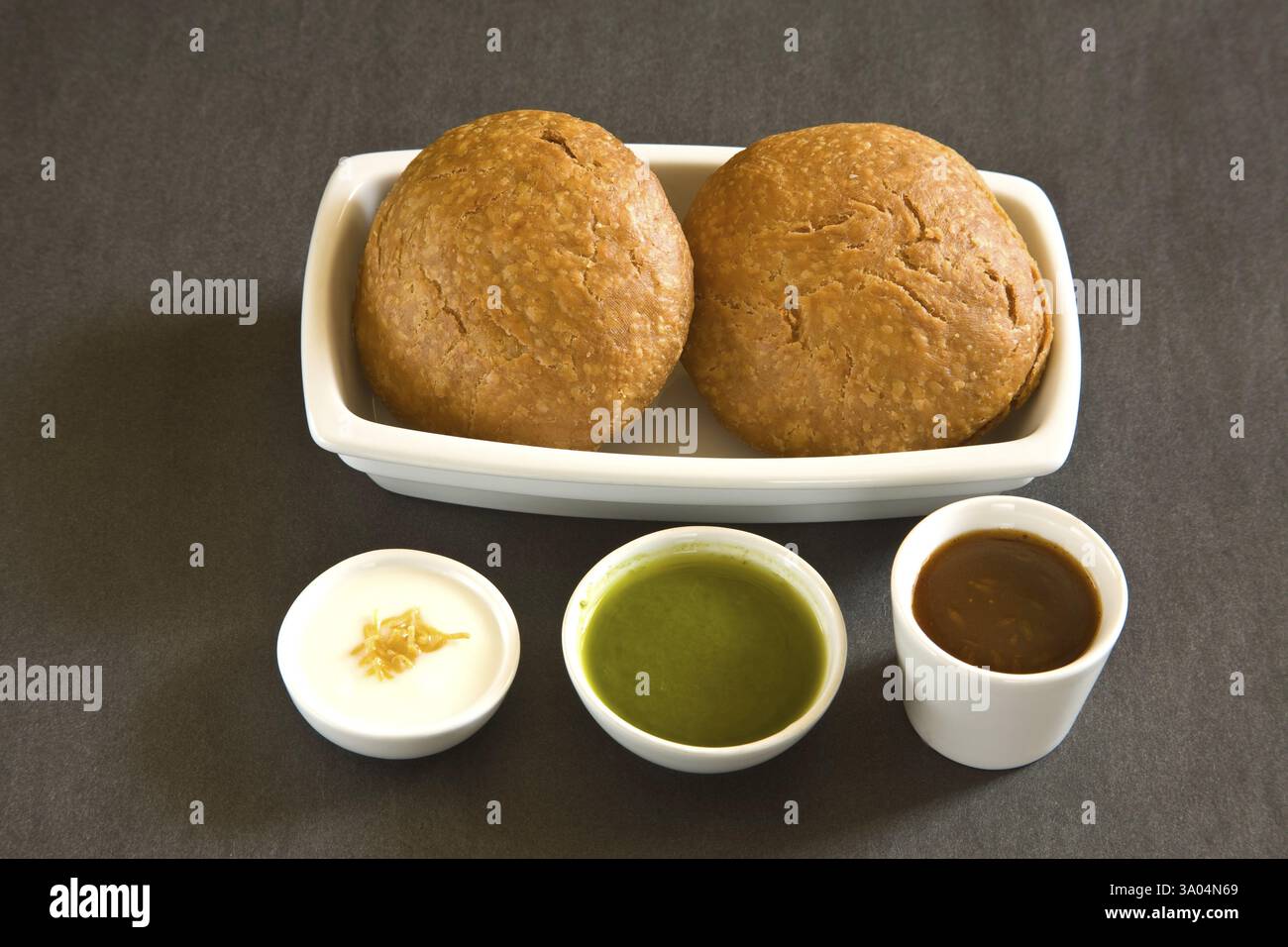 Indian snack fried shahi khasta kachori chaat in bowl yogurt green ...