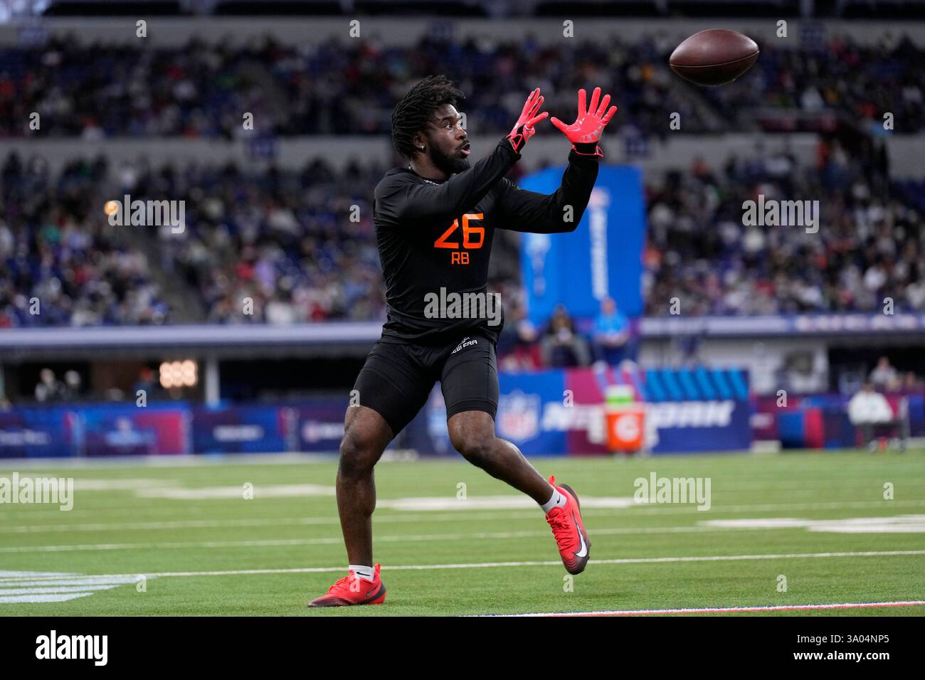 Kansas running back Devin Neal runs a drill at the NFL football ...