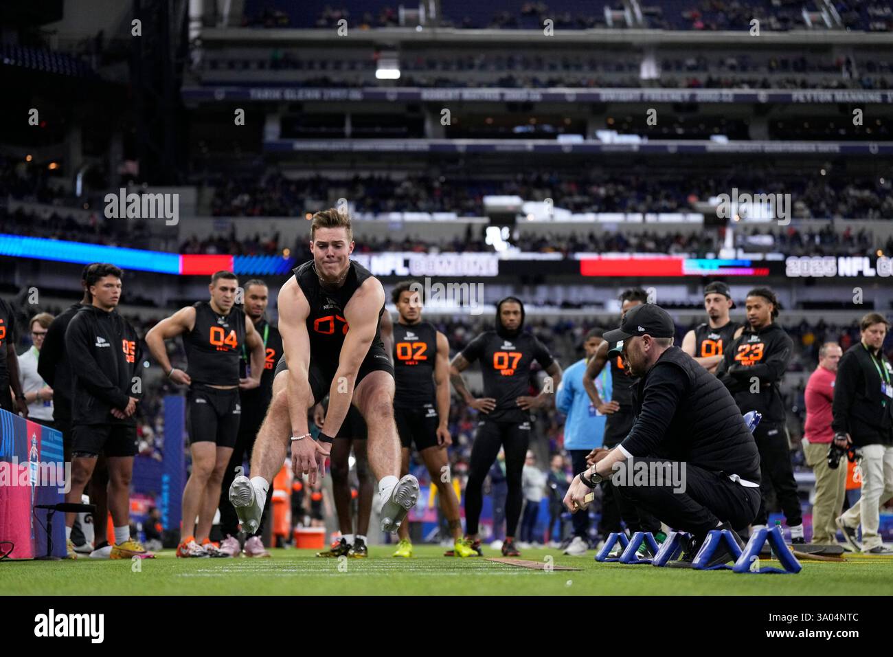 Ohio State quarterback Will Howard runs a drill at the NFL football ...