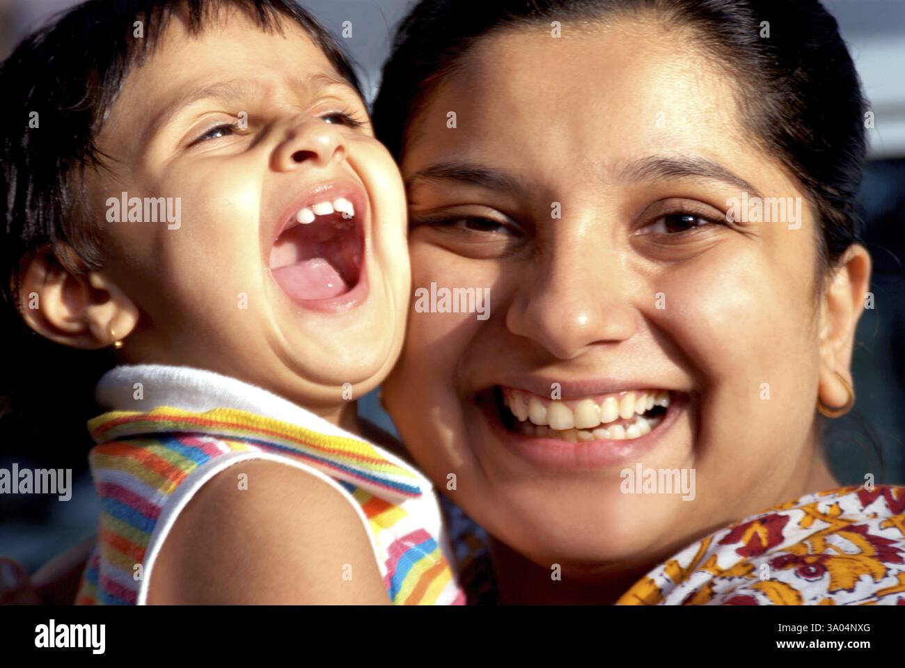 Indian Mother and Child cheeks touching laughing, India, Asia, MR#364 ...