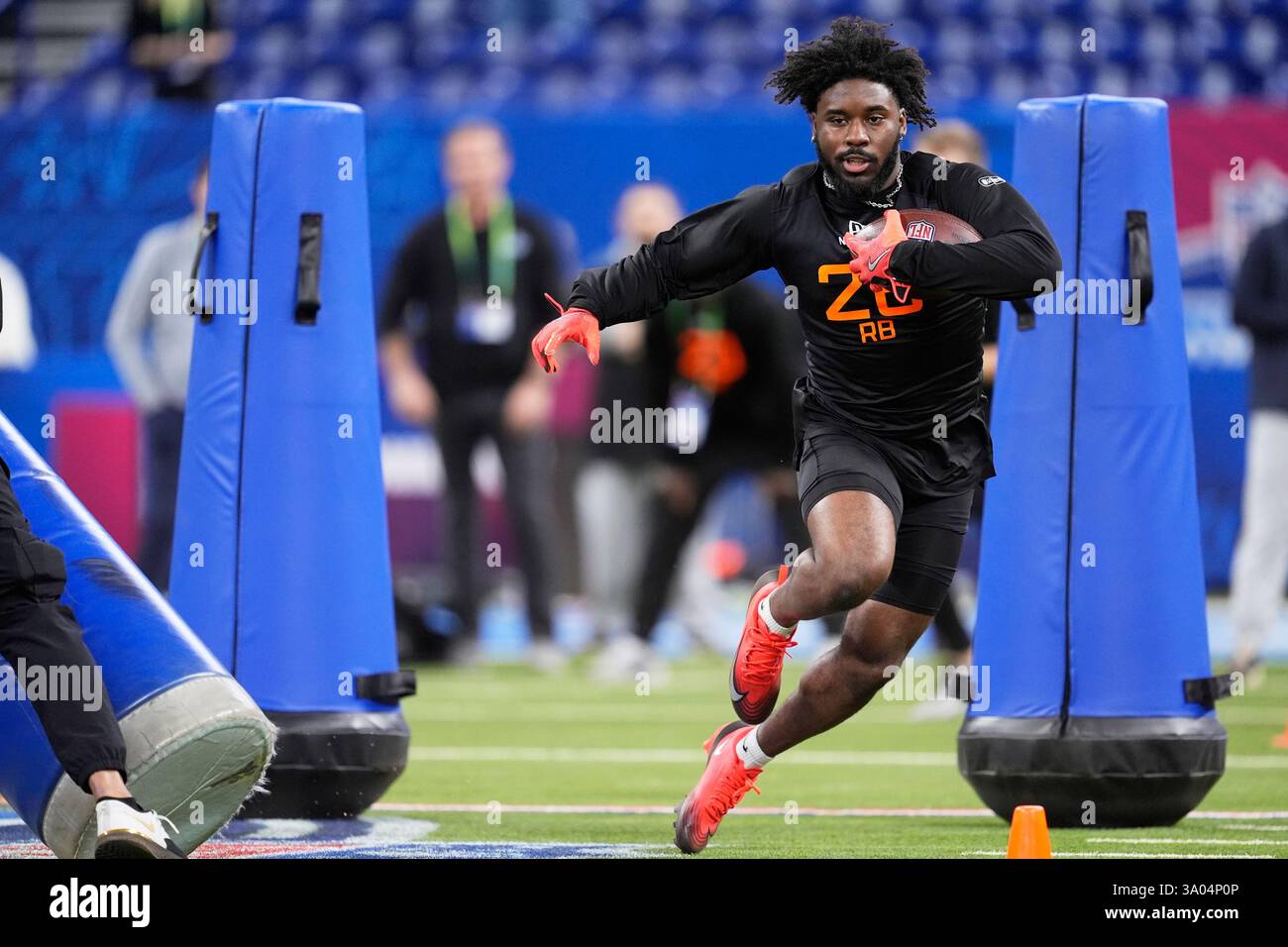 Kansas running back Devin Neal runs a drill at the NFL football ...