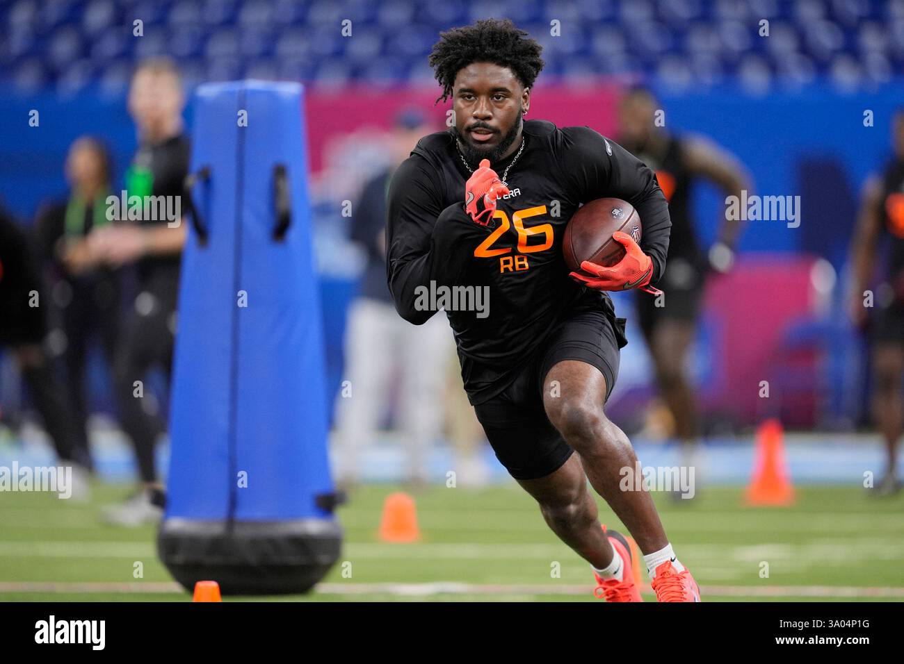 Kansas running back Devin Neal runs a drill at the NFL football ...