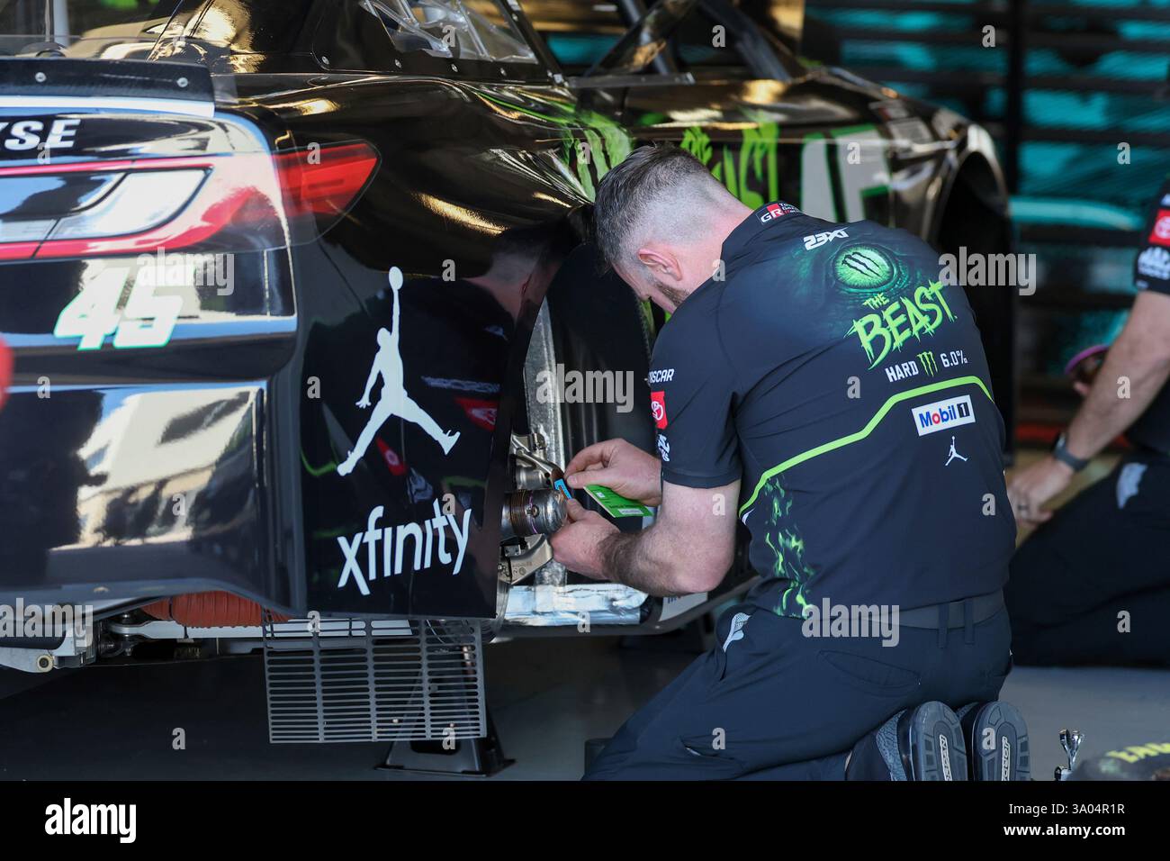 AUSTIN, TX - MARCH 02: A team member for Tyler Reddick (#45 23XI Racing ...