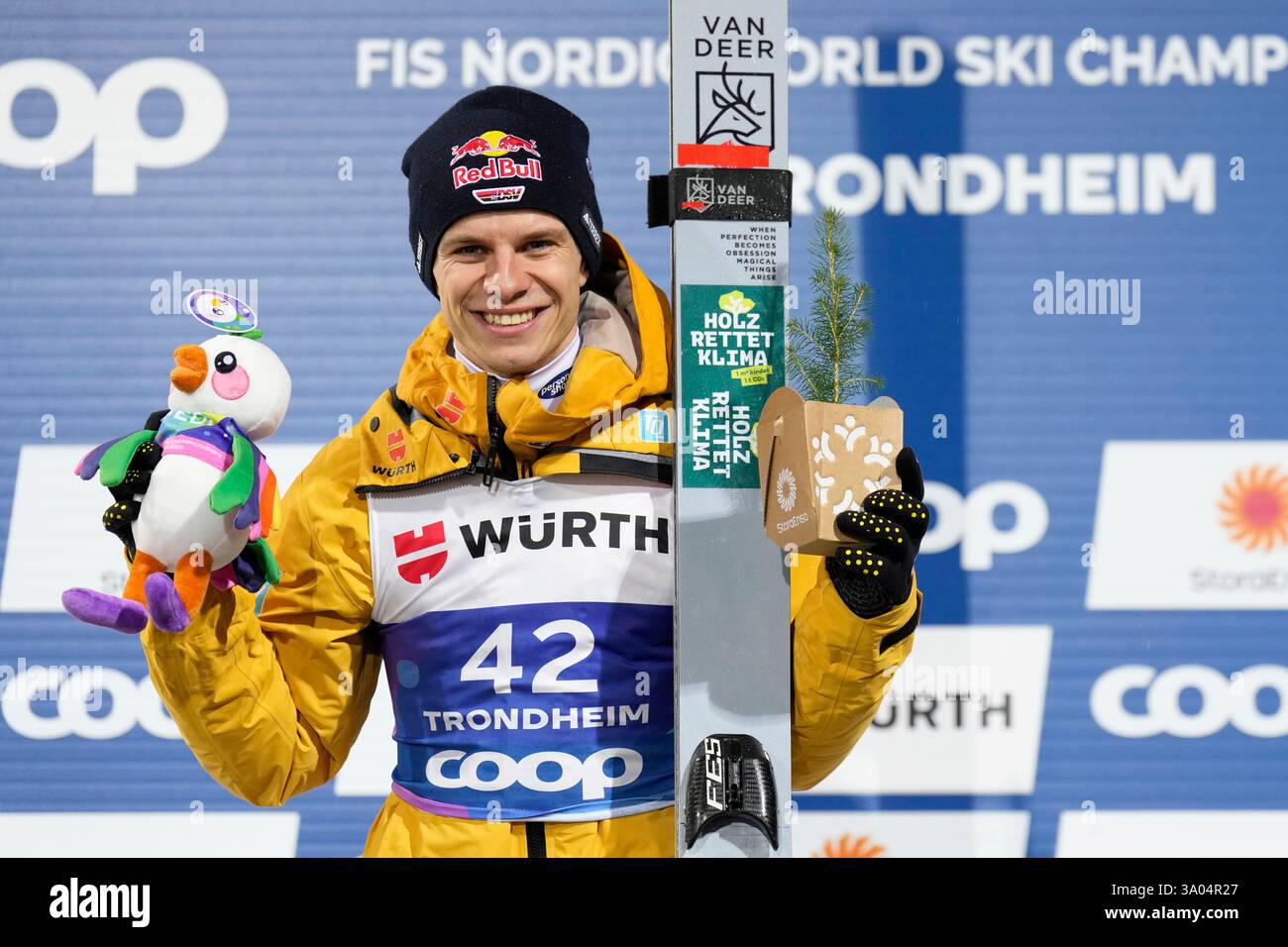Andreas Wellinger, of Germany, poses after winning the silver medal in ...