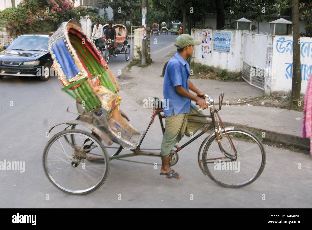Cycle Rickshaw Rider Riding empty Vehicle on street at Dhaka ...