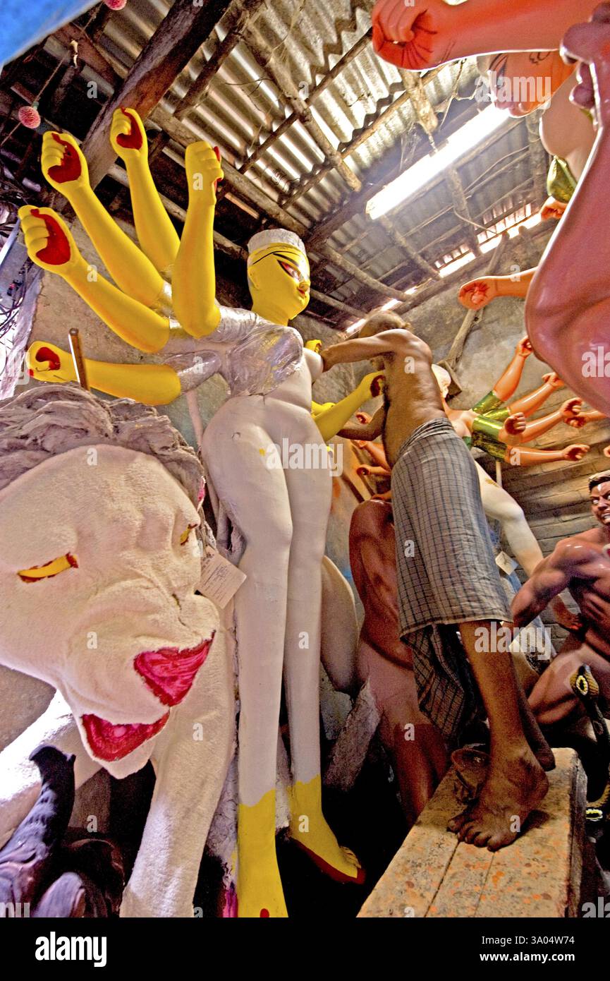 Clay modeller working on image making of goddess Durga, Kumartuli ...