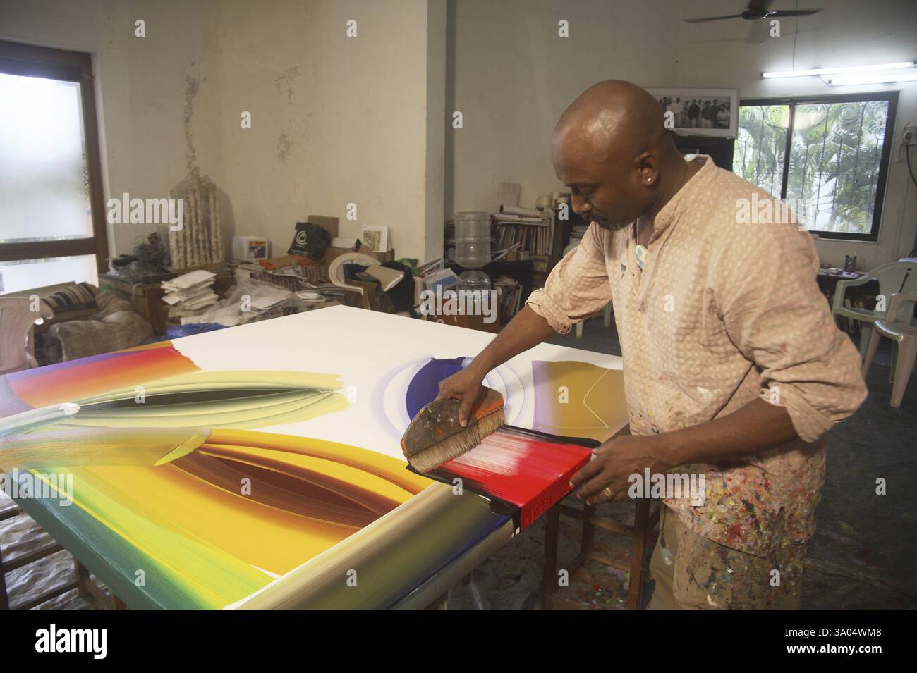 Indian contemporary artist Bose Krishnamachari in his studio working on ...