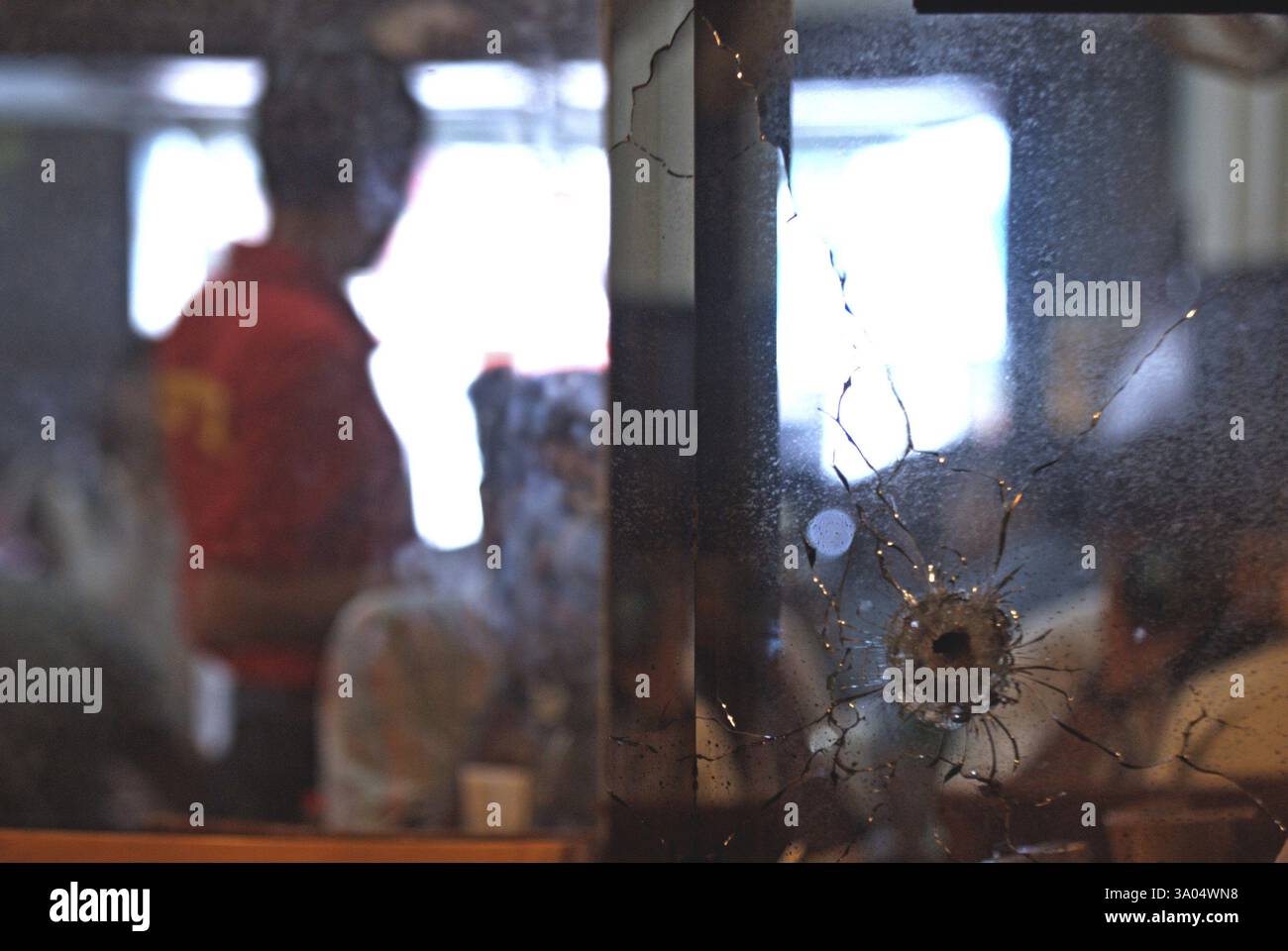Bullet mark on glass at cafe leopold in colaba after terrorist attack ...