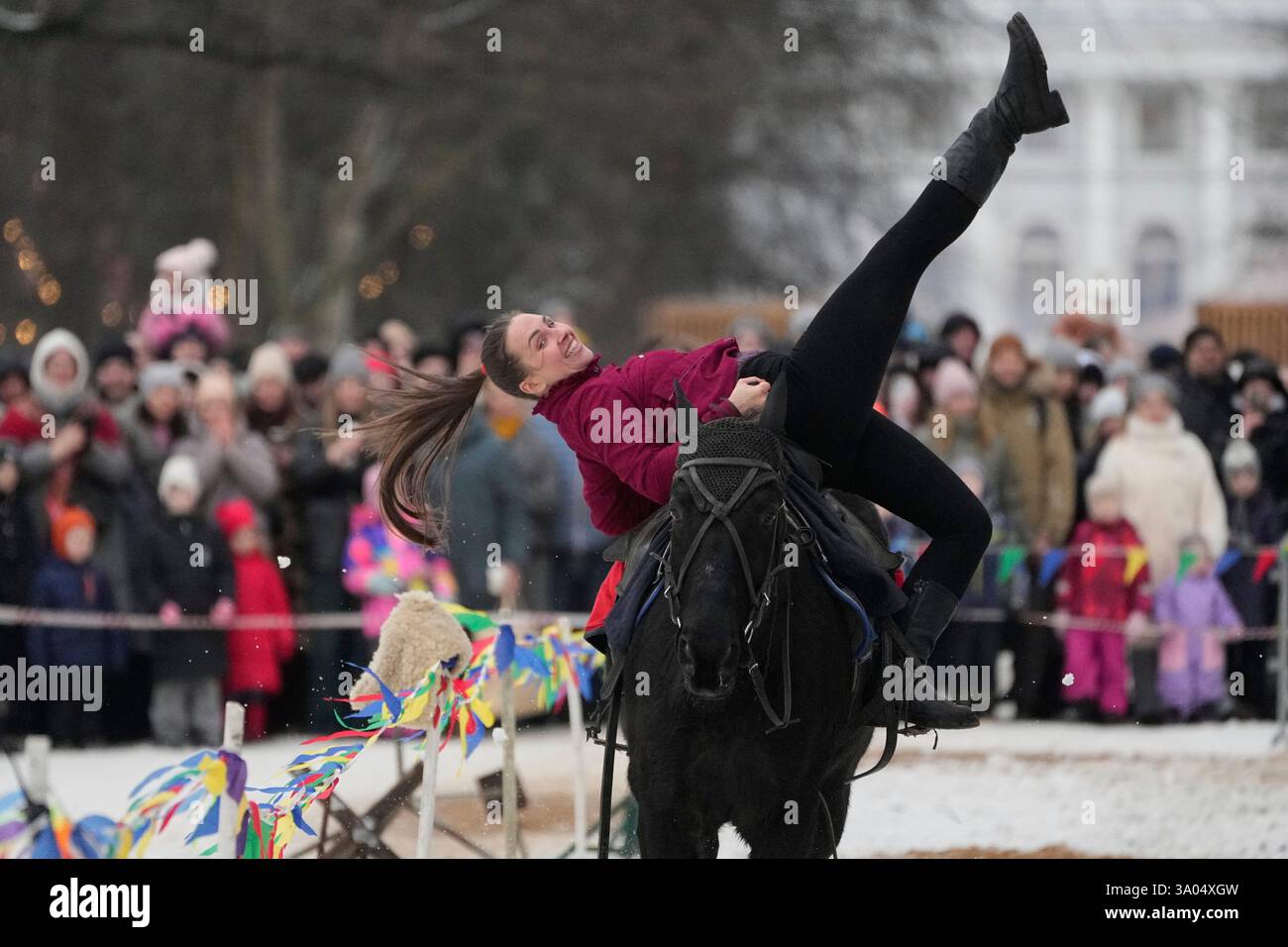 A rider shows off her skills during Maslenitsa (Shrovetide) holiday ...