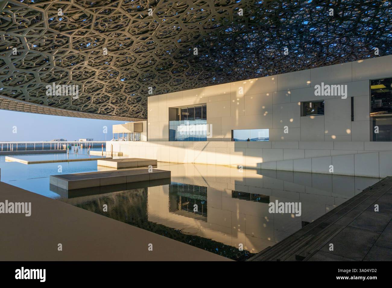 Louvre Abu Dhabi famous museum. Plain white walls surrounding an ...