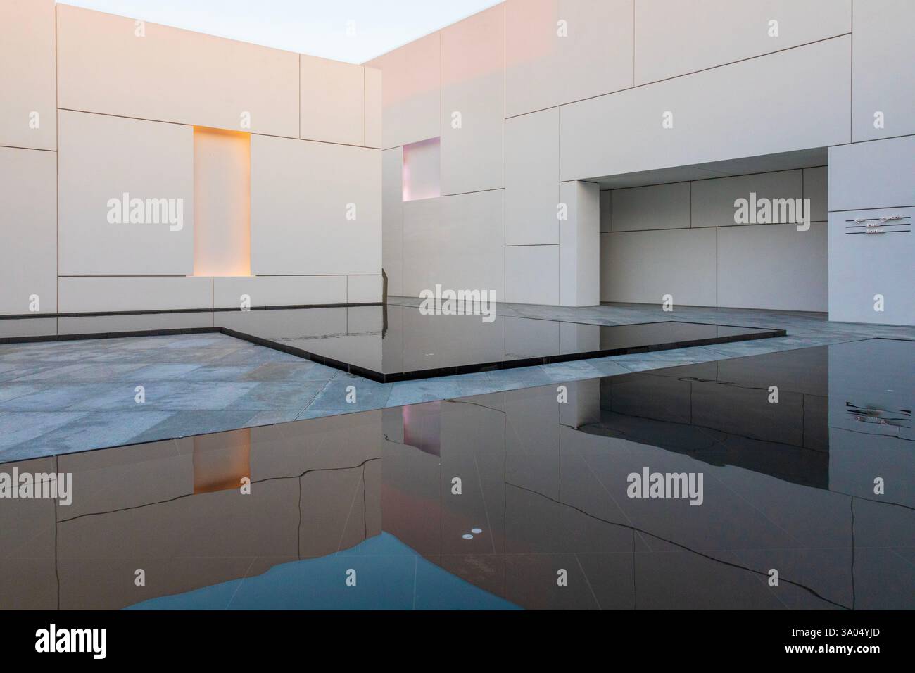 Louvre Abu Dhabi famous museum. Plain white walls surrounding an ...