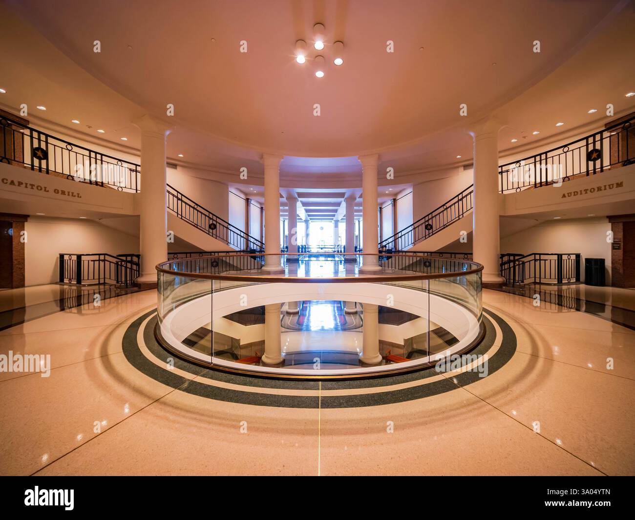 Interior view of the Texas Capitol with visitors exploring the halls at ...