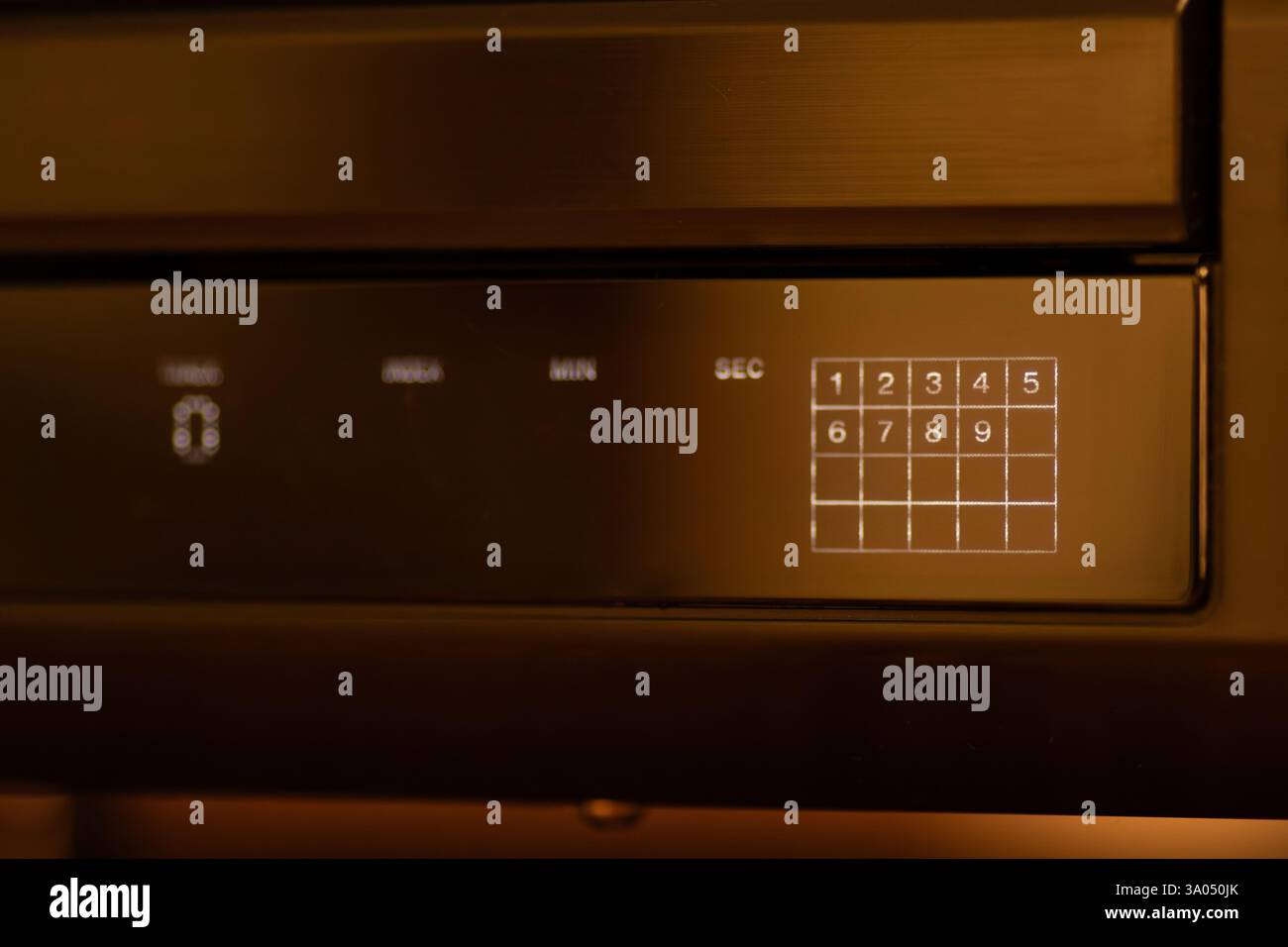 Detailed view of a modern audio device showing its illuminated digital ...