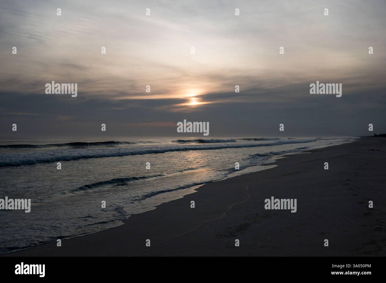 Sunset on the peaceful Praia Seca beach white sands shoreline at ...