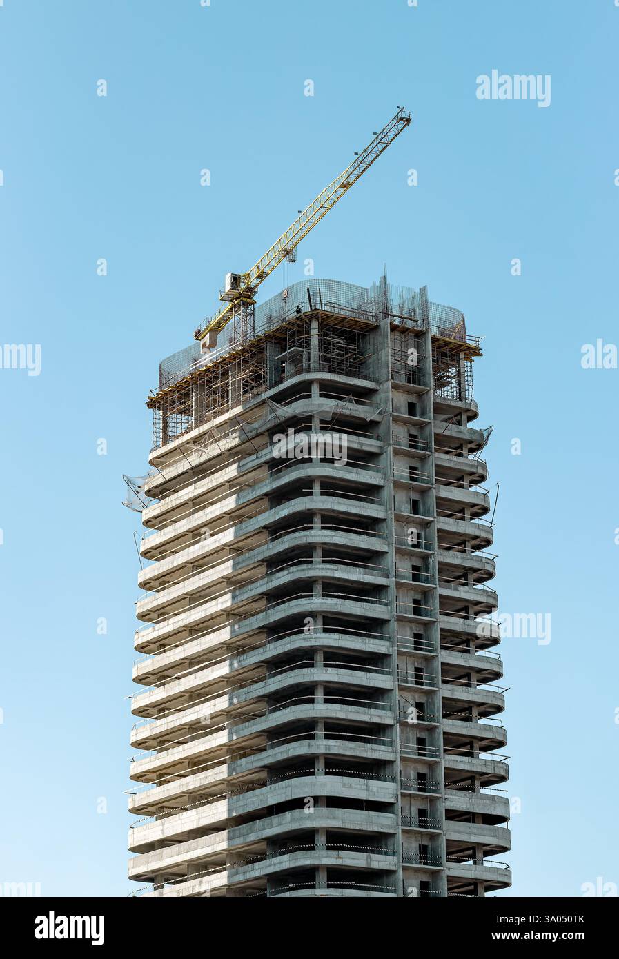 Modern architecture under construction in the city. Unfinished high ...