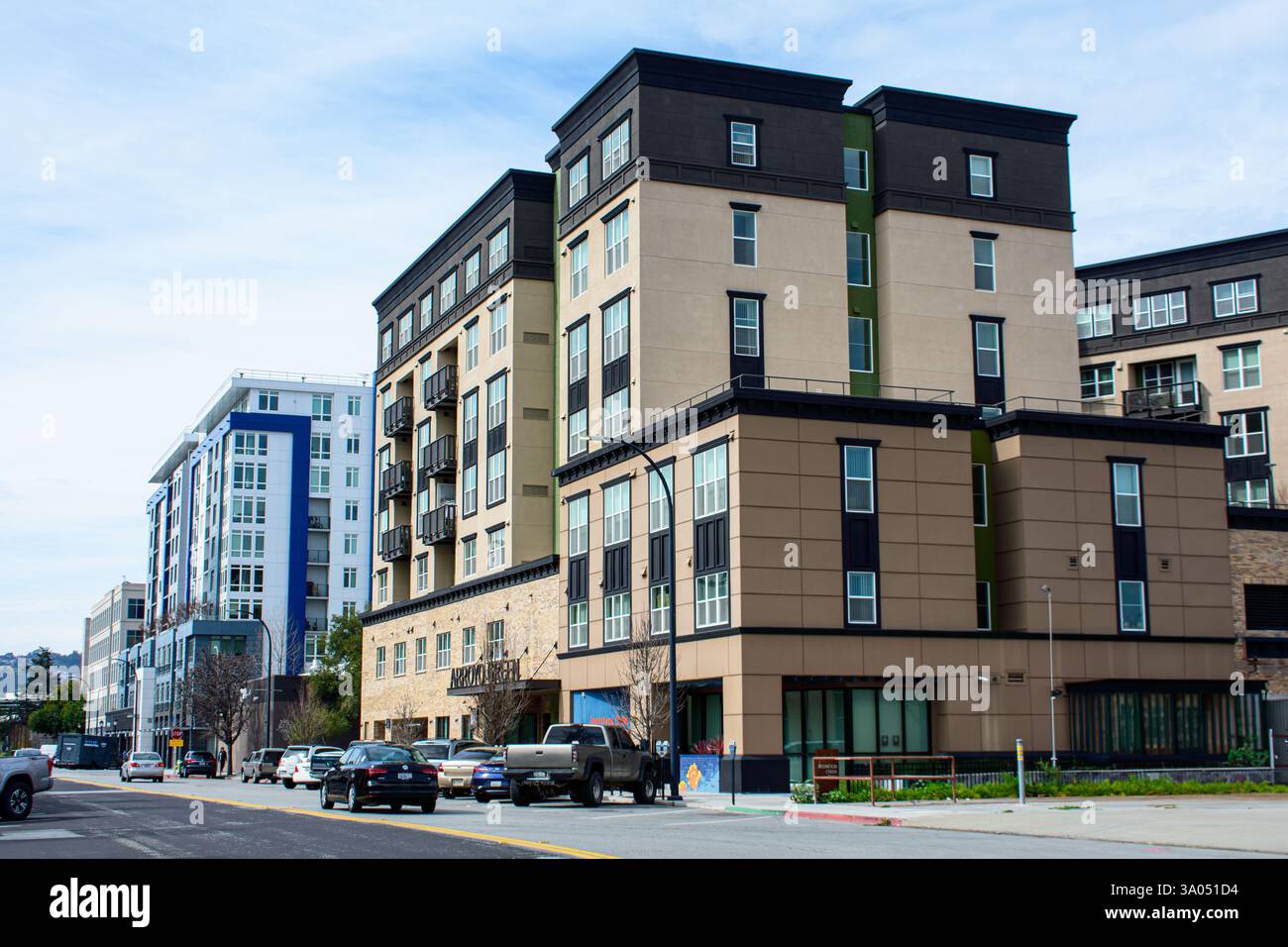 Urban streetscape showcasing multi-story apartments along a busy ...