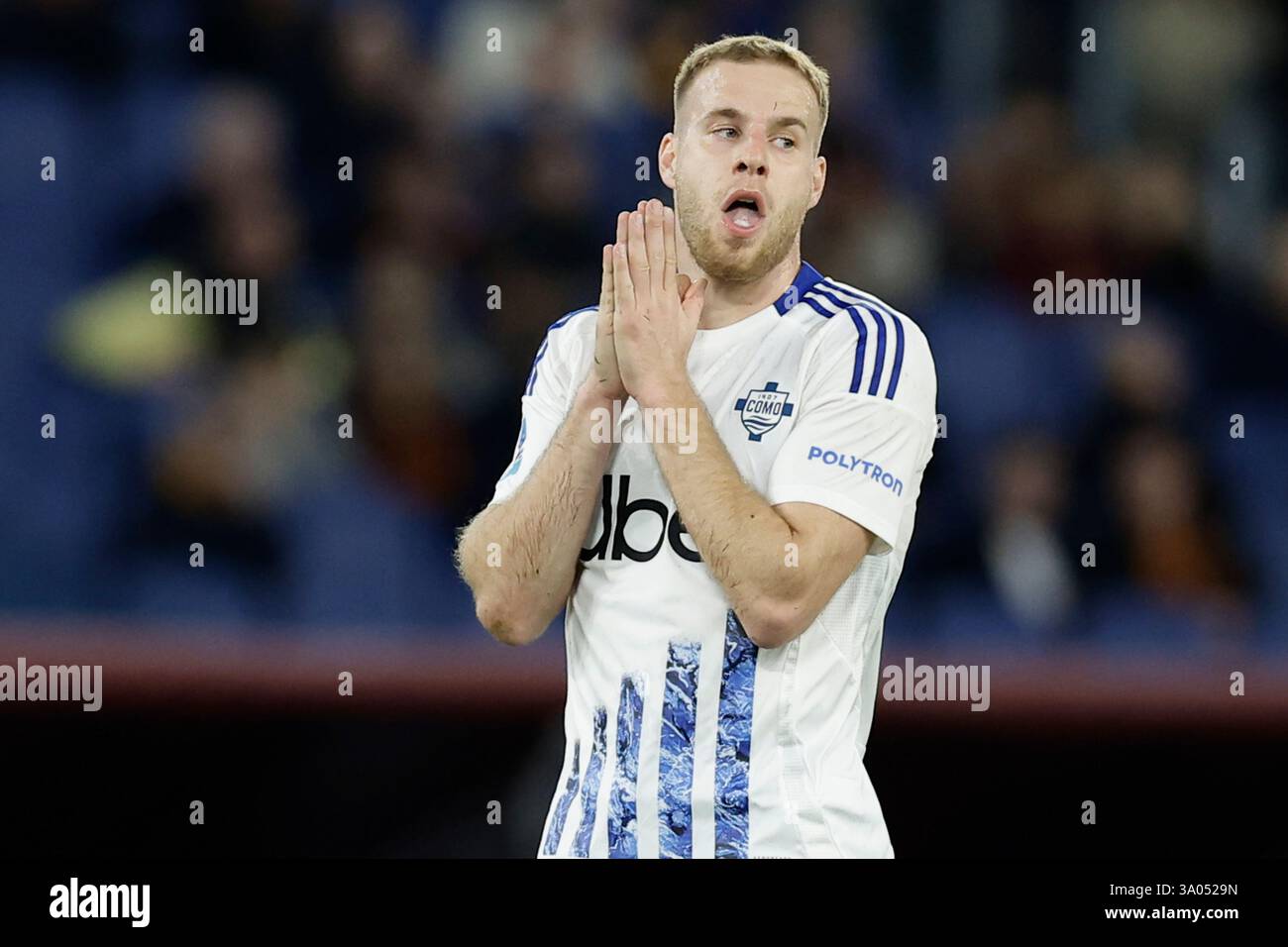 Como’s Croatian defender Ivan Smolcic looks dejected during the Serie A ...