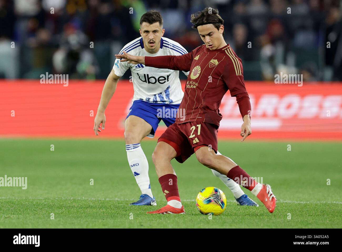 Roma’s Argentinian forward Paulo Dybala challenges for the ball with ...