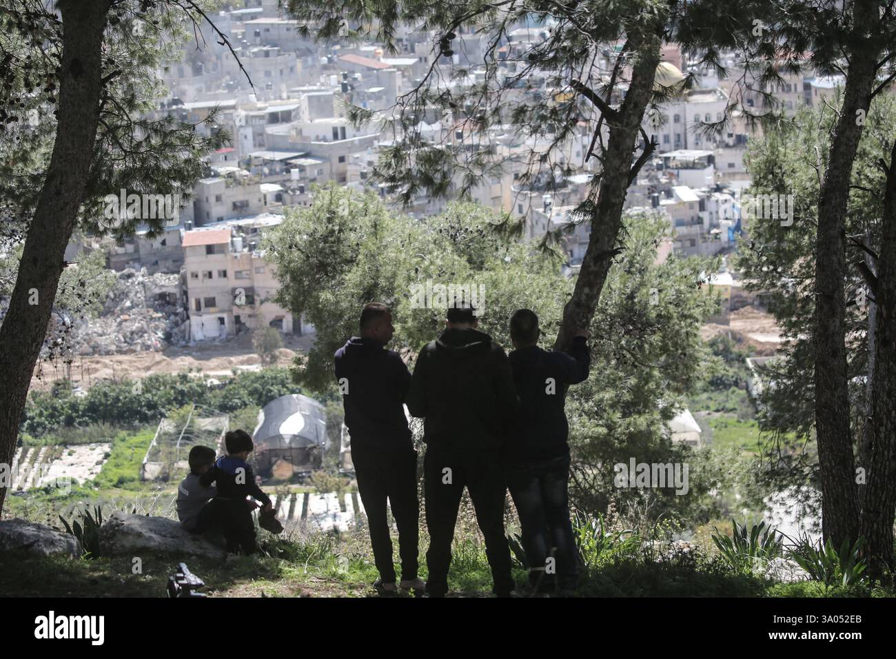 Palestinian Shehadeh family displaced from Nour Shams camp look at ...