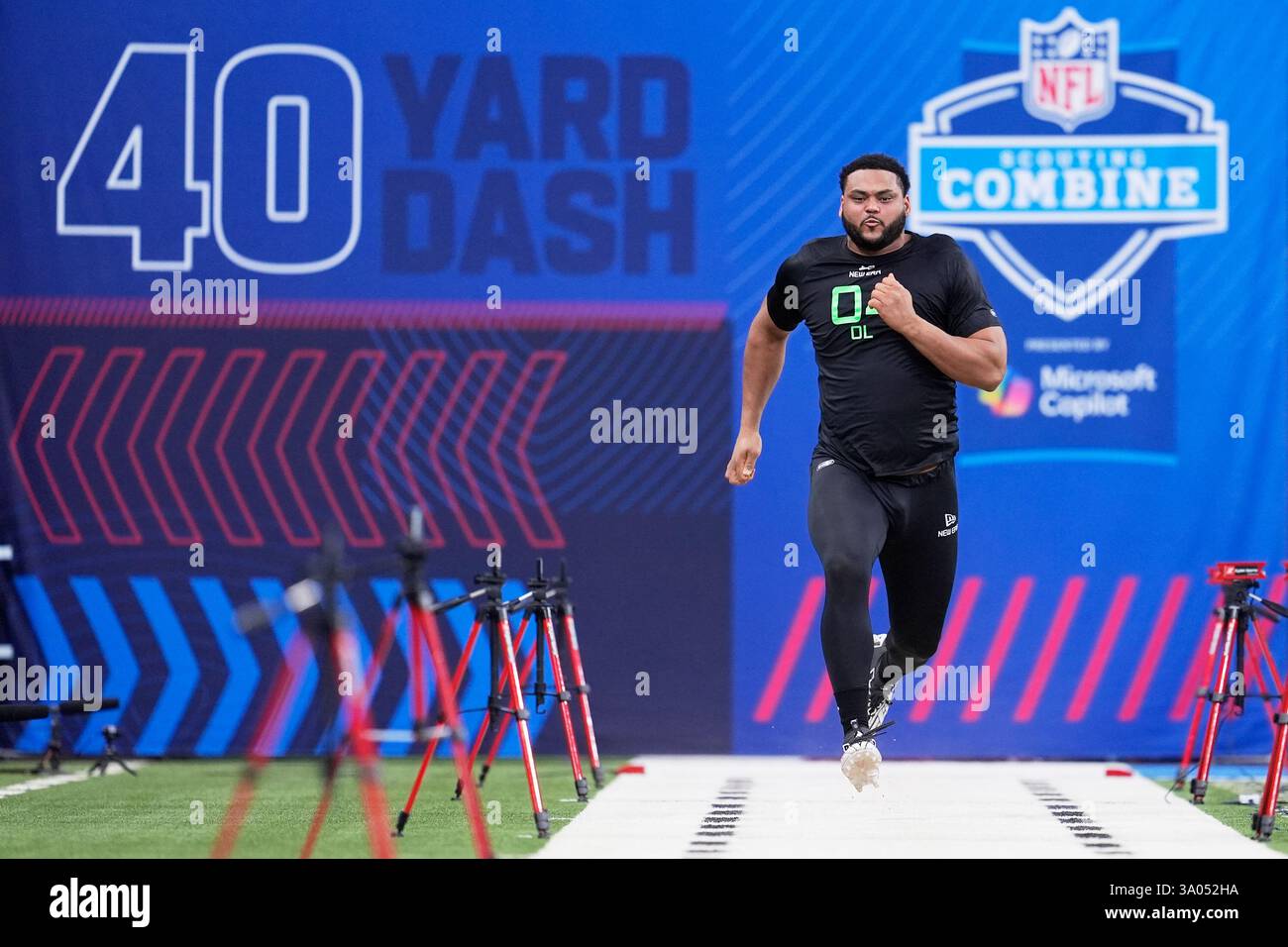 Kansas offensive lineman Logan Brown runs the 40-yard dash at the NFL ...