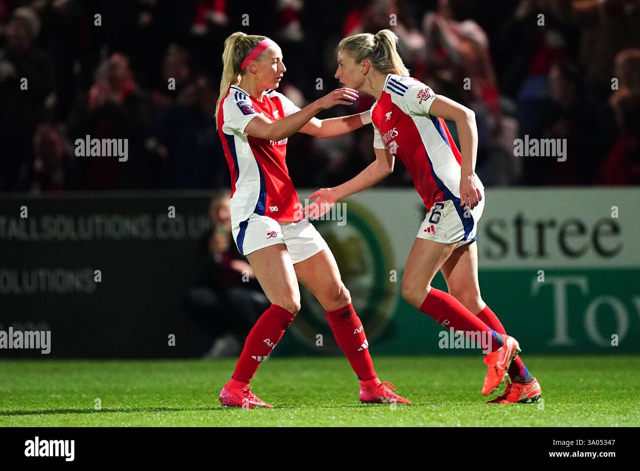 Arsenal's Leah Williamson (right) celebrates scoring their side's third ...