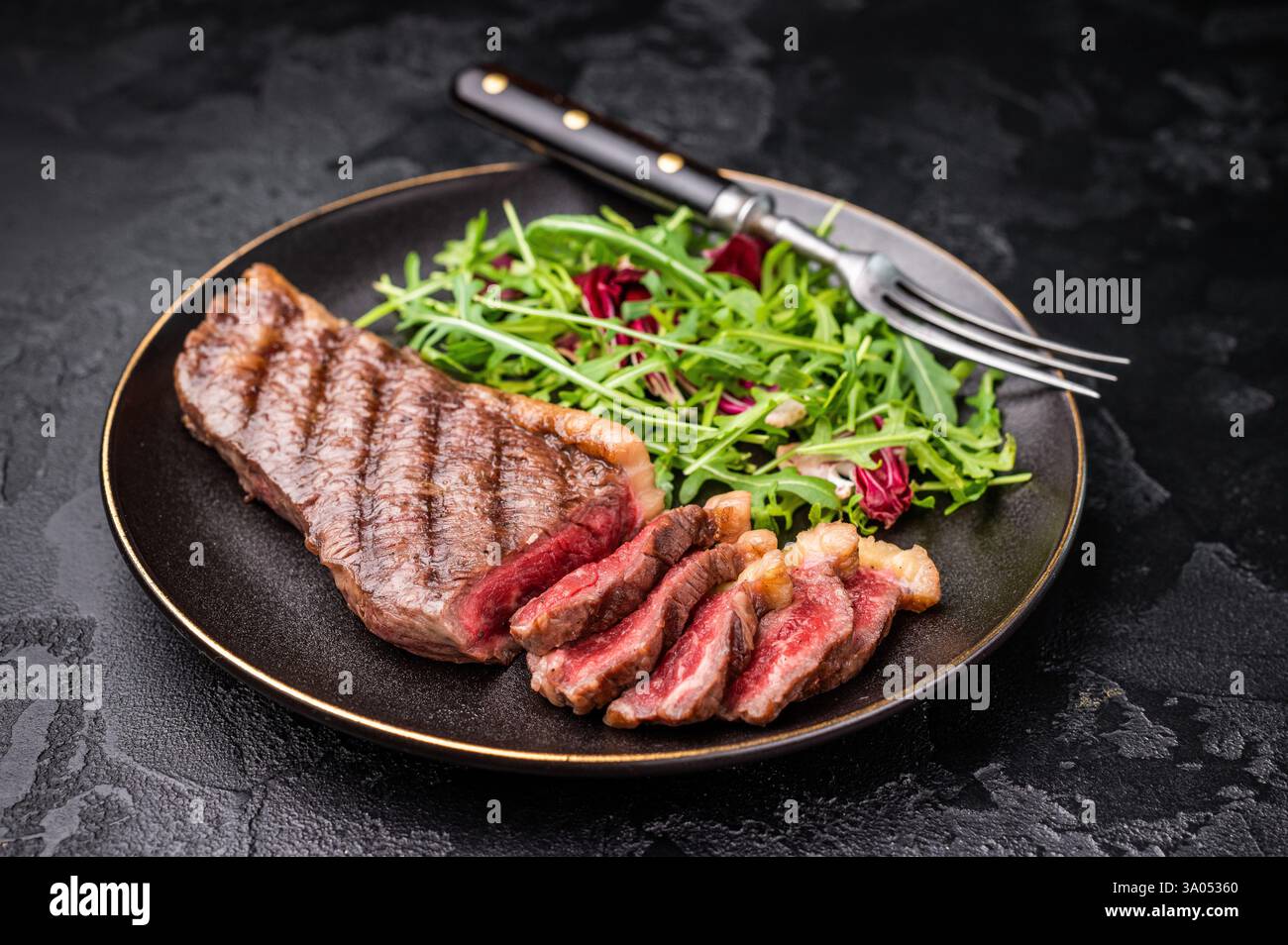 BBQ roast Rump Cap beef steak, Brazilian Picanha with salad on a plate ...