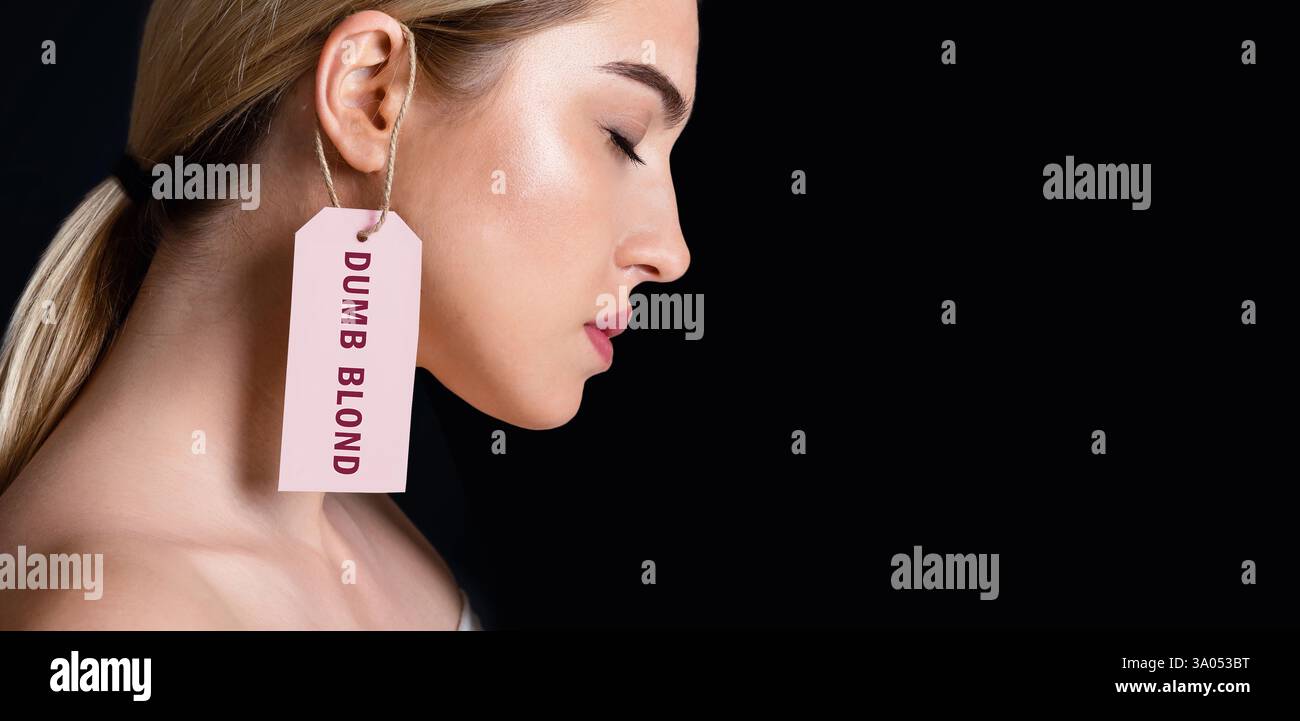 Dumb blonde. Tired and sad woman touches temple with her hand with ...