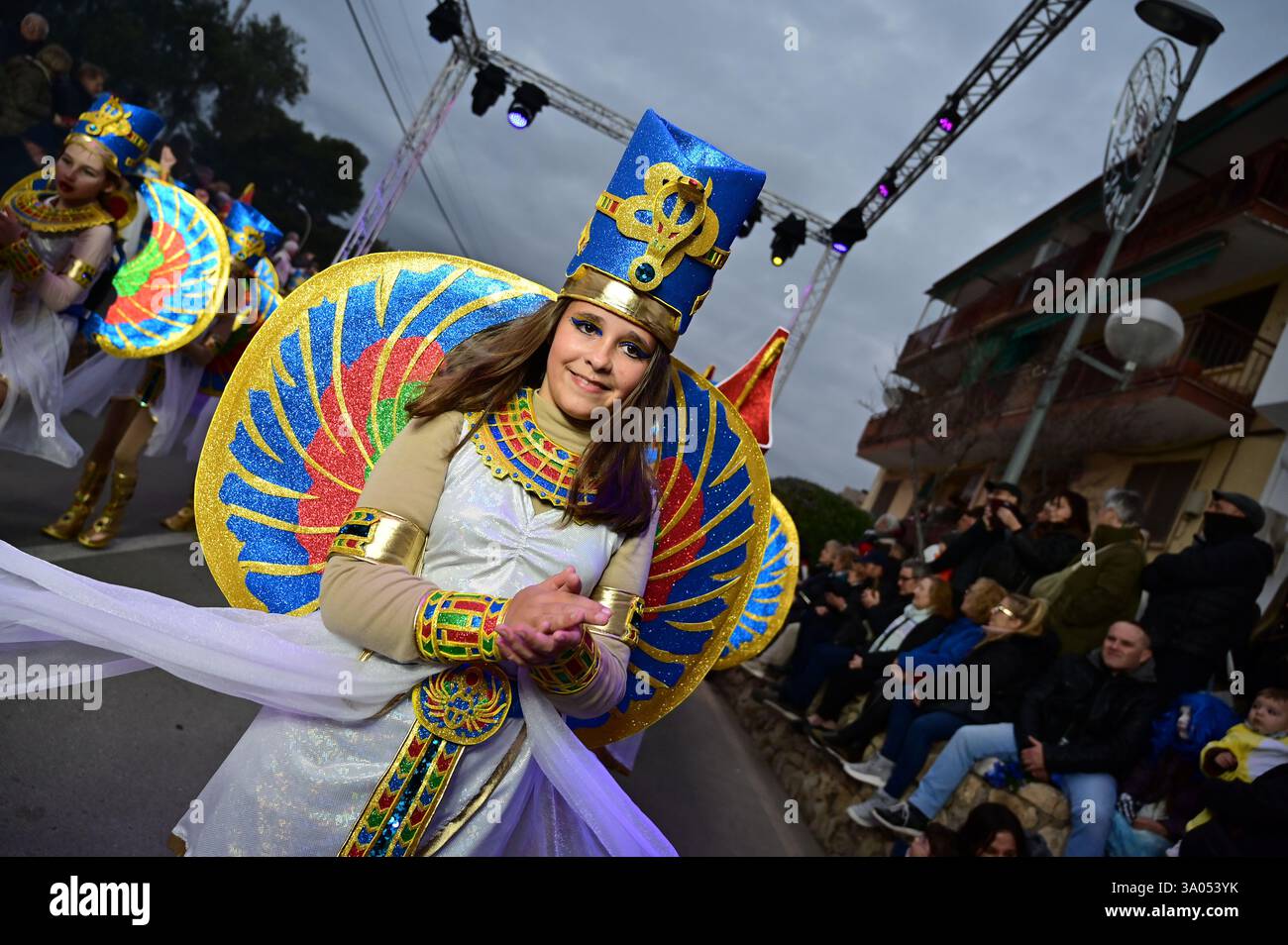 A girl in costume parades during the 2025 Carnival parade in Cunit. The ...