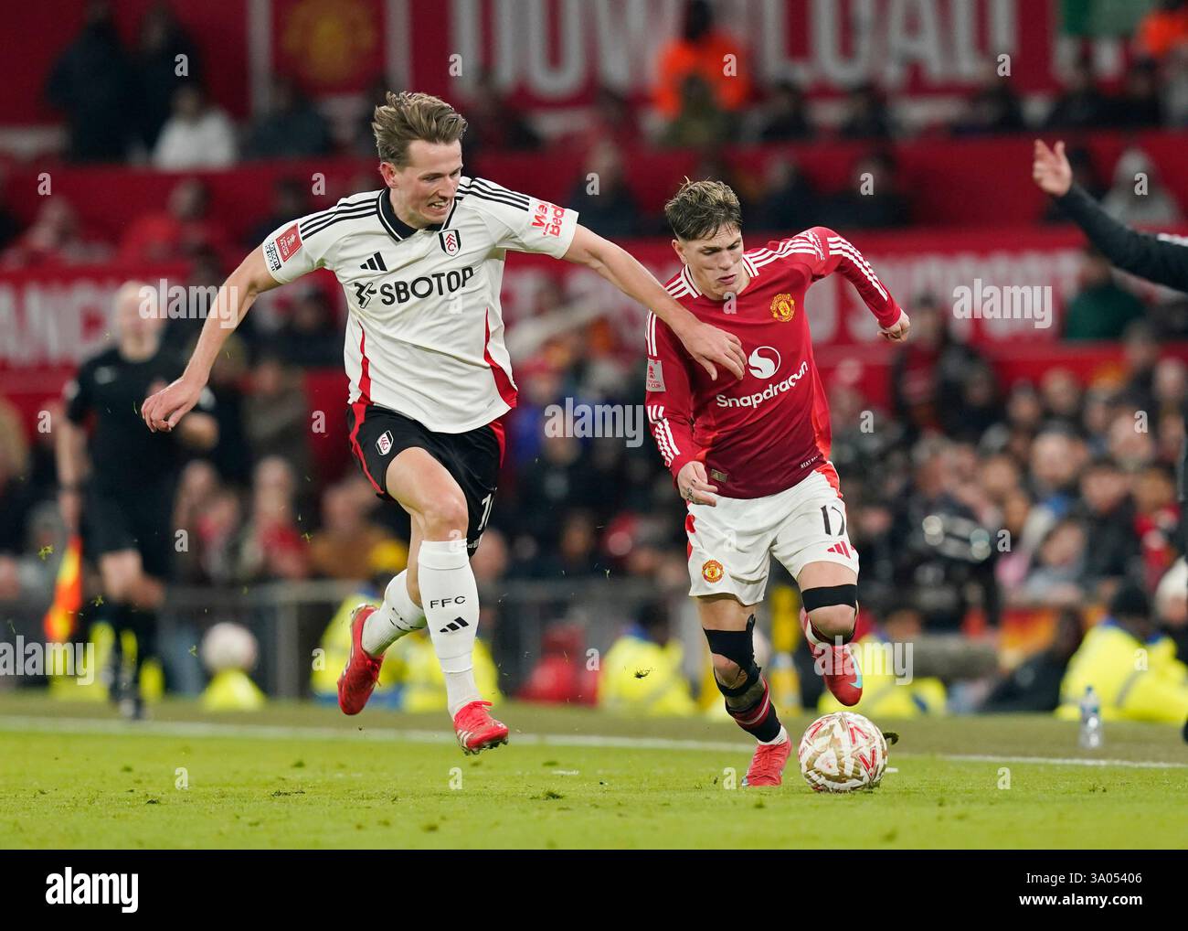 Manchester, UK. 2nd Mar, 2025. Sander Berge of Fulham tussles with ...
